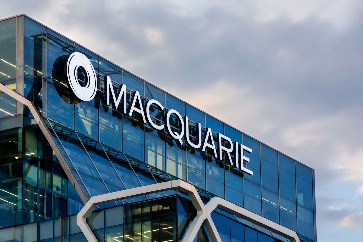 Macquarie Slips as Budget Risk Cools a Record-High Rally